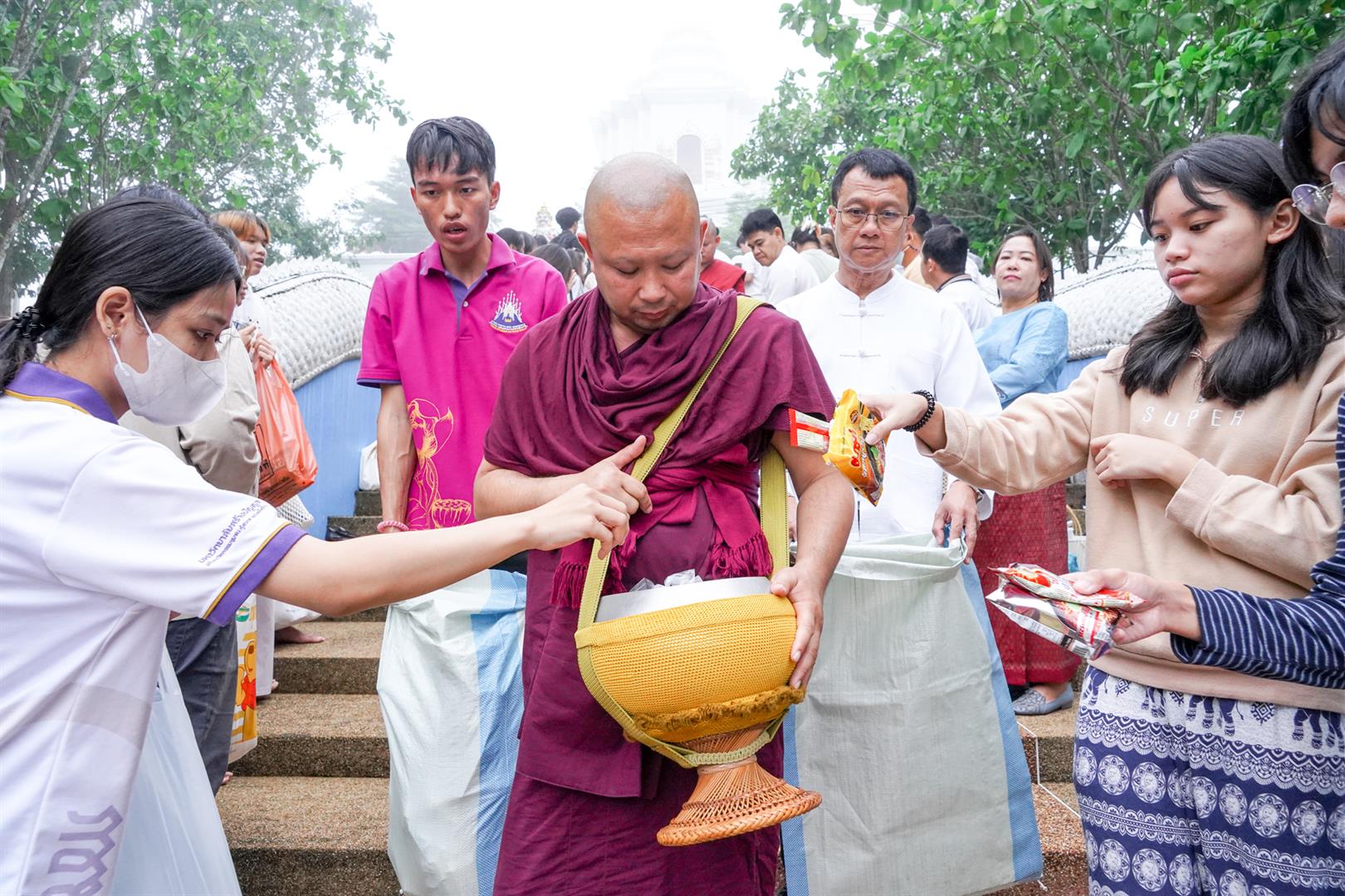 School of Education participates in the traditional activity of Tak Bat ...